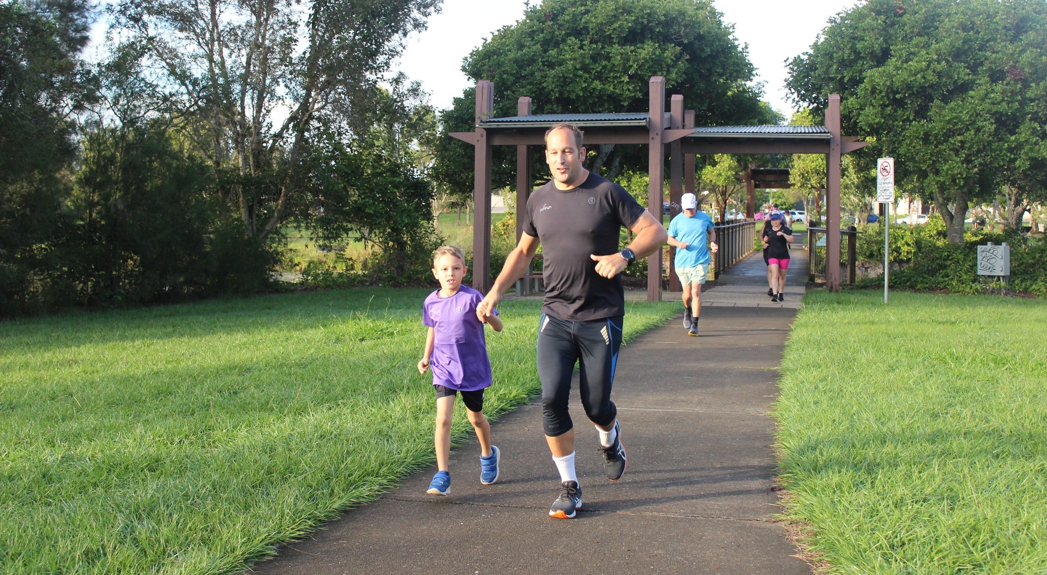 Alexiah picking-up parkrun photography | parkrun AU Blog